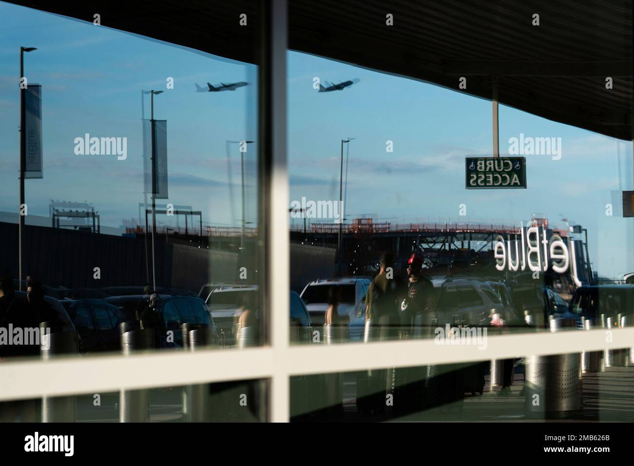 An airplane takes off at John F. Kennedy International Airport on ...