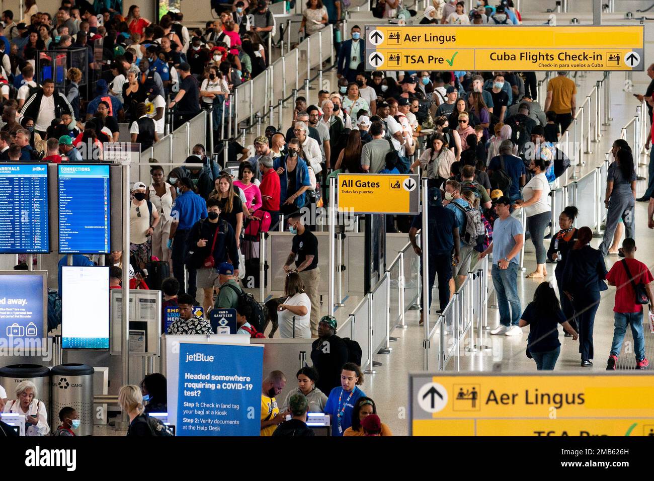 People wait in a TSA line at the John F. Kennedy International Airport ...