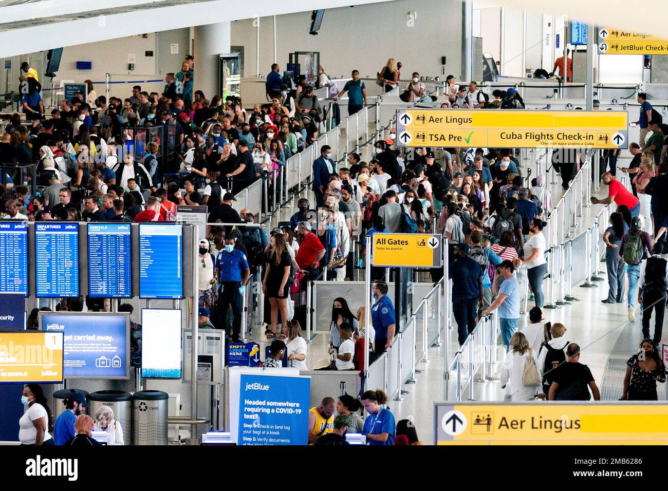 People wait in a TSA line at the John F. Kennedy International Airport ...