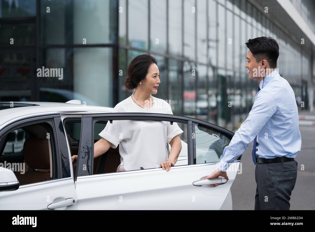 Older women choose and buy cars Stock Photo - Alamy
