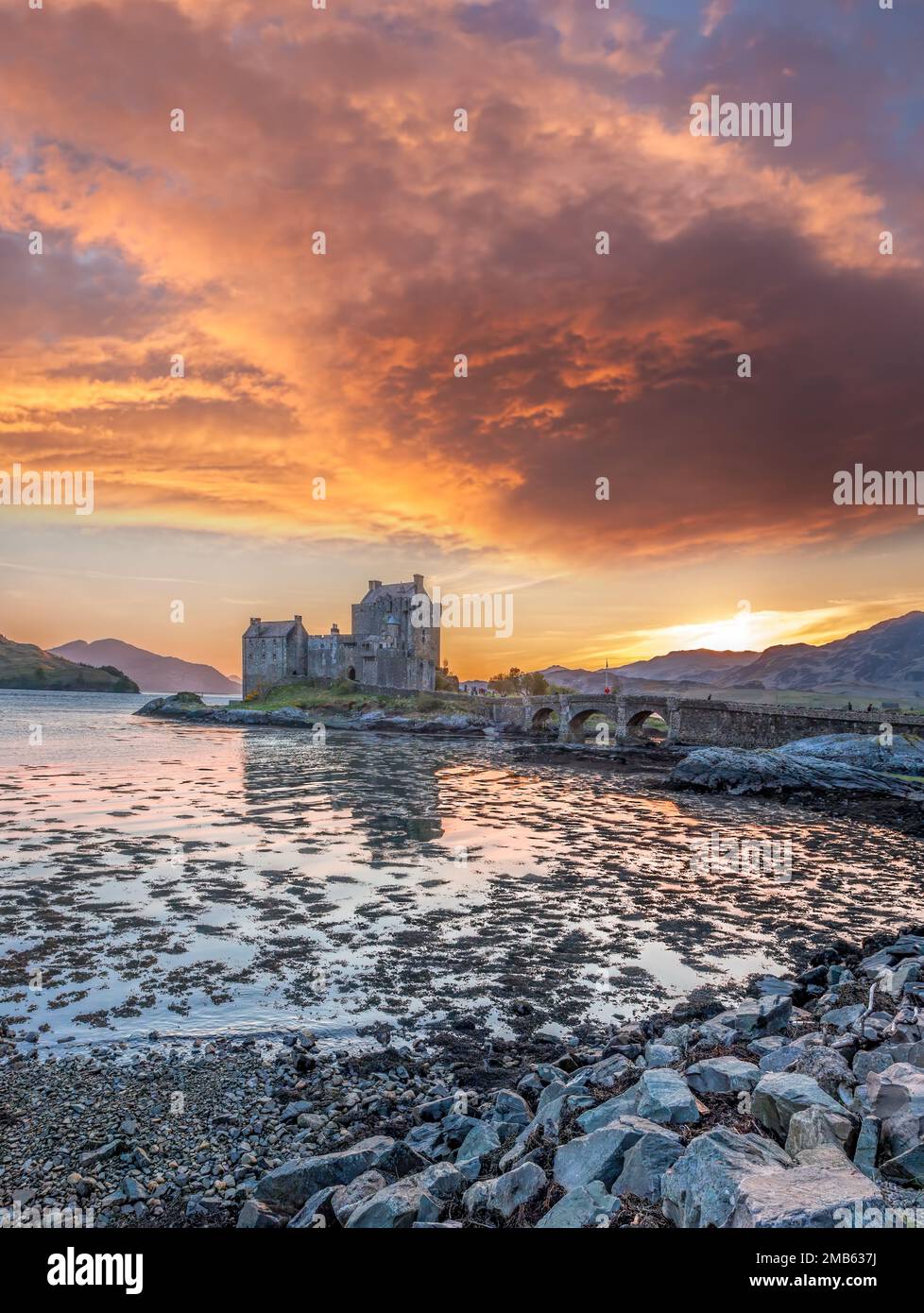 Colorful sunset against Eilean Donan Castle at Kyle of Lochalsh in the ...