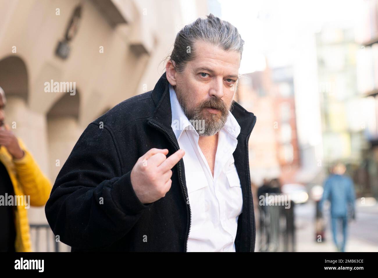 EDITORS: NOTE HAND GESTURE US citizen Jason Penrose, 49, leaves the Old ...