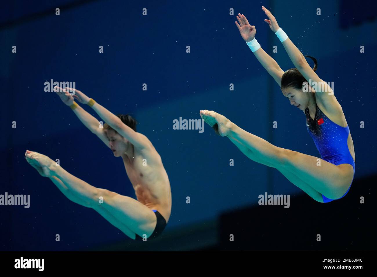 Zhu Zifeng and Lin Shan of China compete during the mixed diving ...