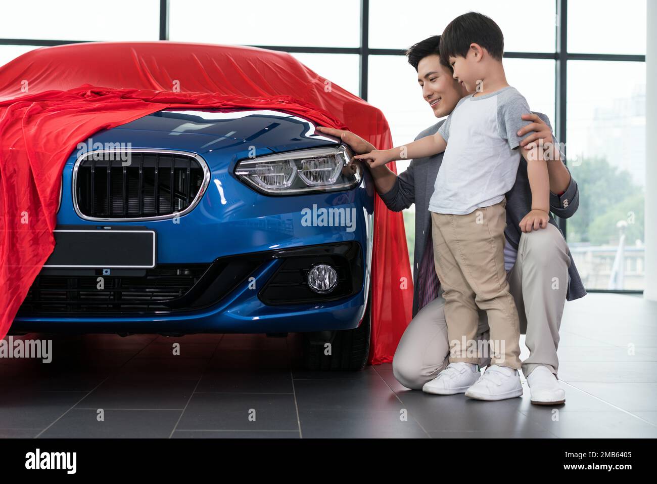 Father and son to buy cars Stock Photo - Alamy