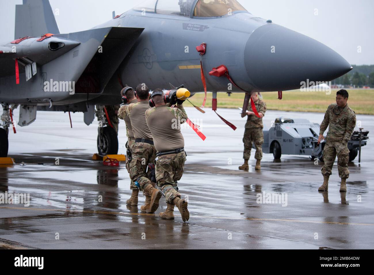 A team of weapons loaders from the 142nd Aircraft Maintenance Squadron ...