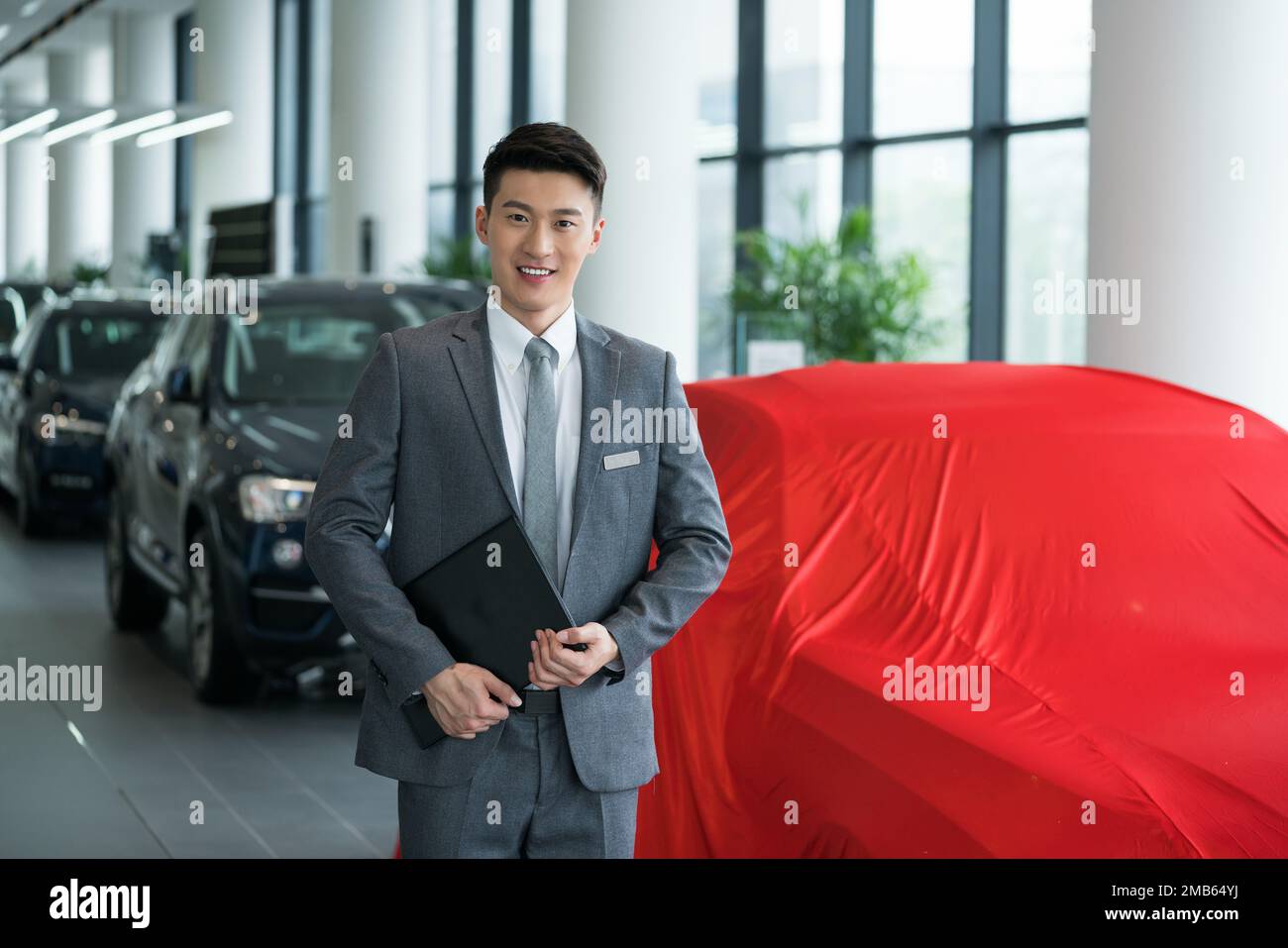 Business young men work in 4 s shop Stock Photo - Alamy
