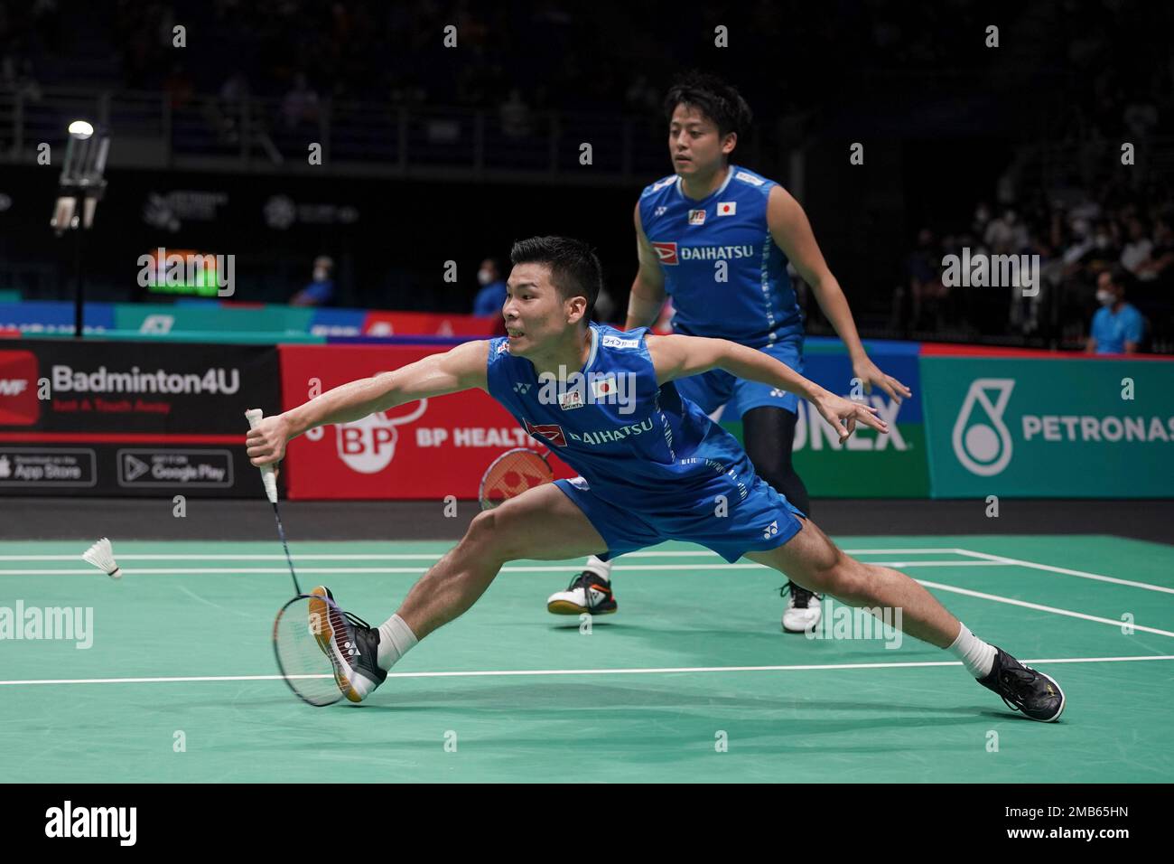 Japan's Taichi Saito, left, and Akira Koga play against Malaysia's Aaron Chia and Soh Wooi Yik ...