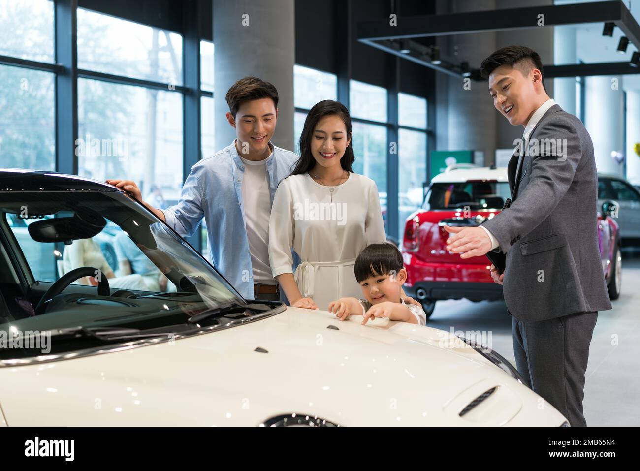 Three of choose and buy cars Stock Photo - Alamy