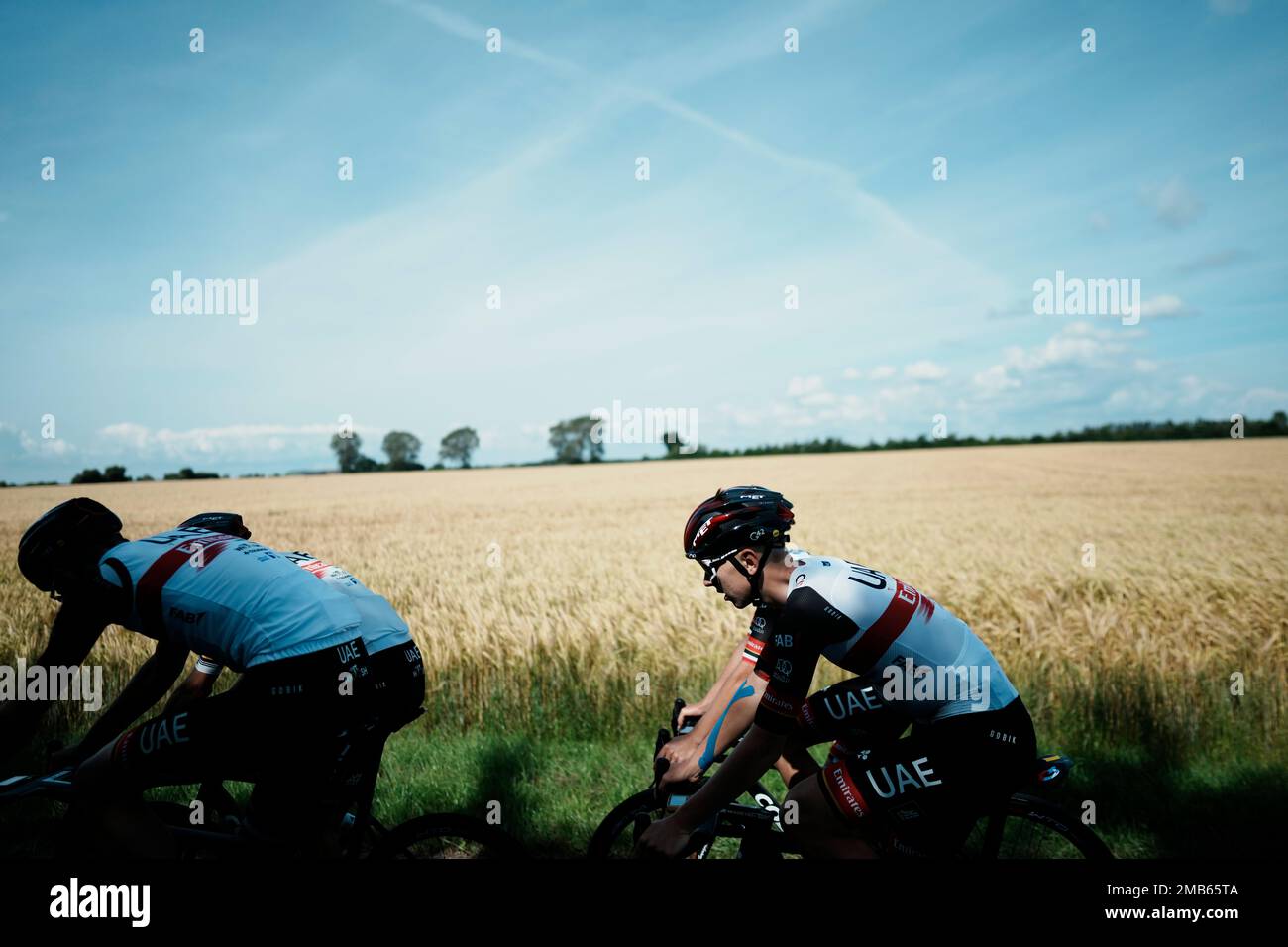 Slovenia's Tadej Pogacar, right, and his teammates ride during a ...