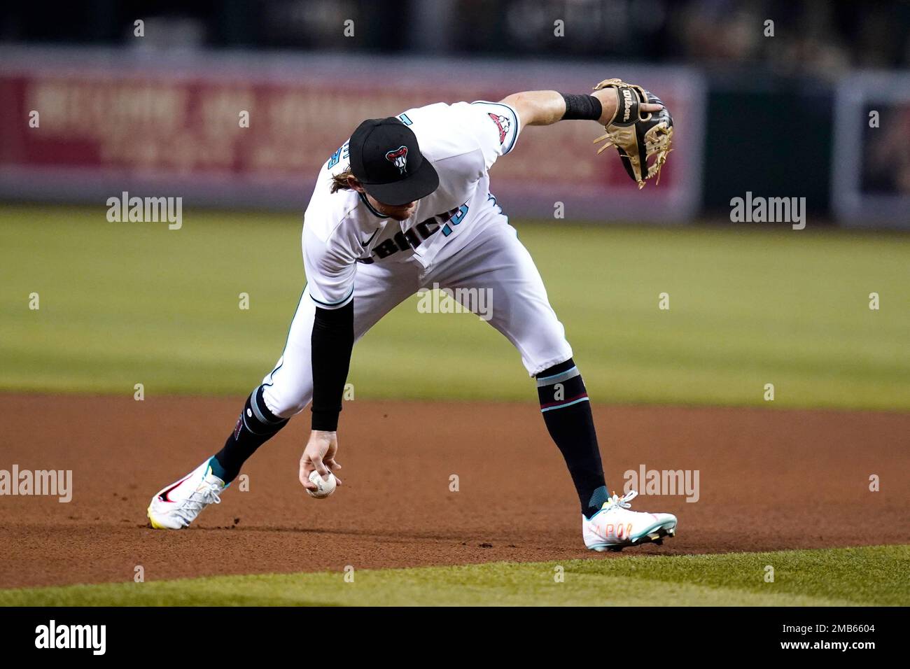 Arizona Diamondbacks shortstop Jake Hager fields a grounder against the ...