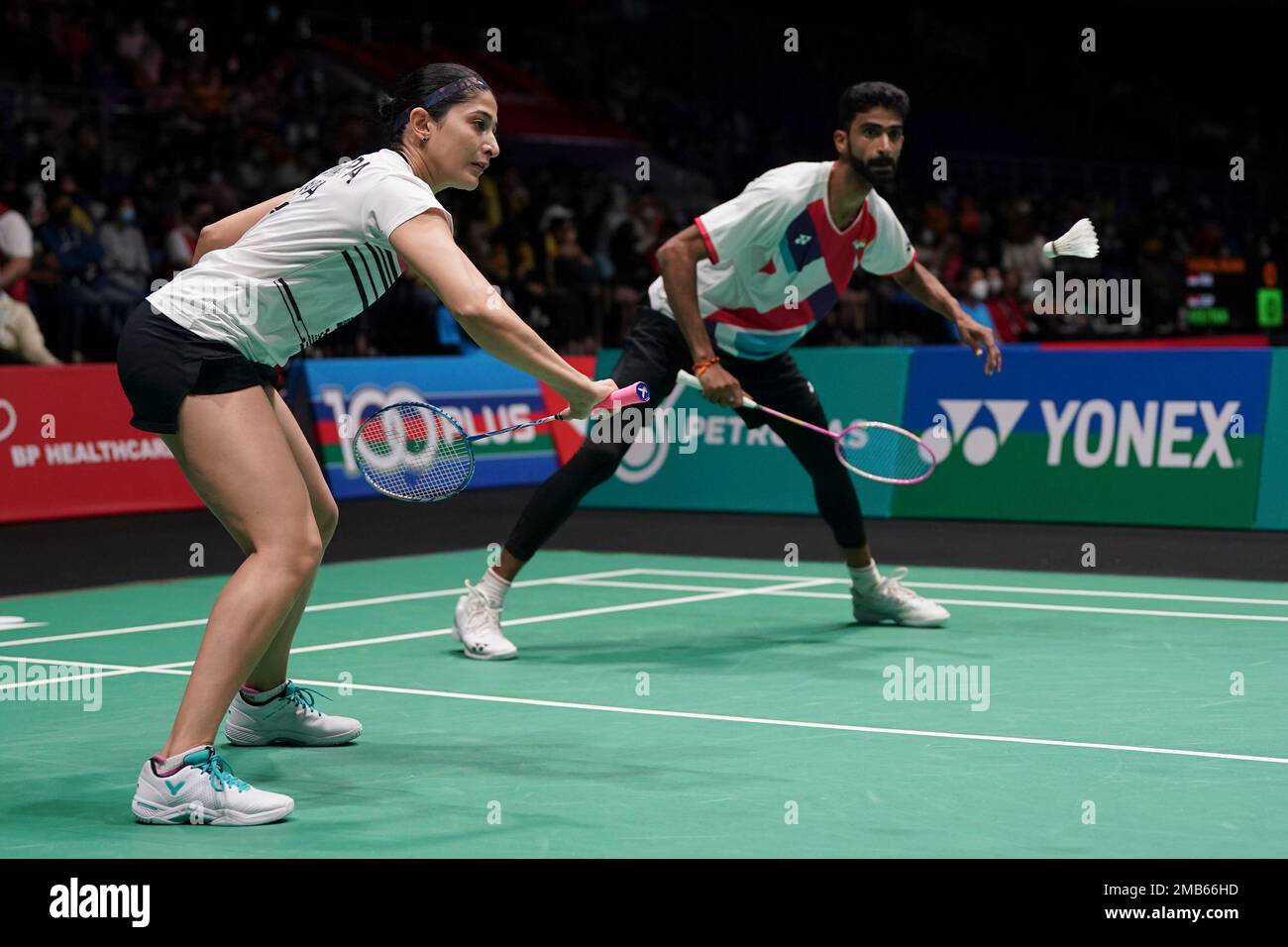 Ashwini Ponnappa, left, and Reddy B. Sumeeth of India compete against ...