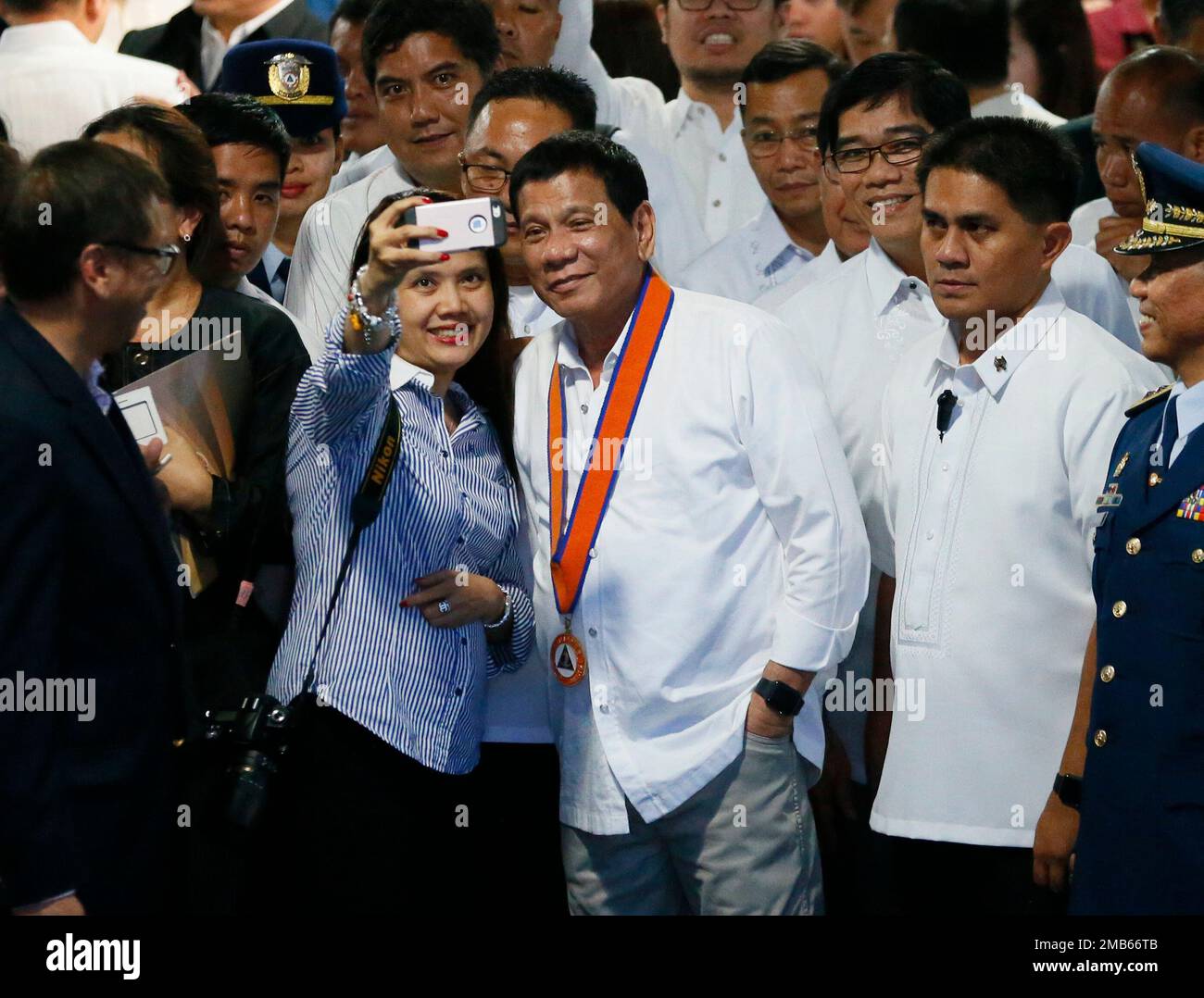 FILE - Philippine President Rodrigo Duterte, center, poses for a selfie ...