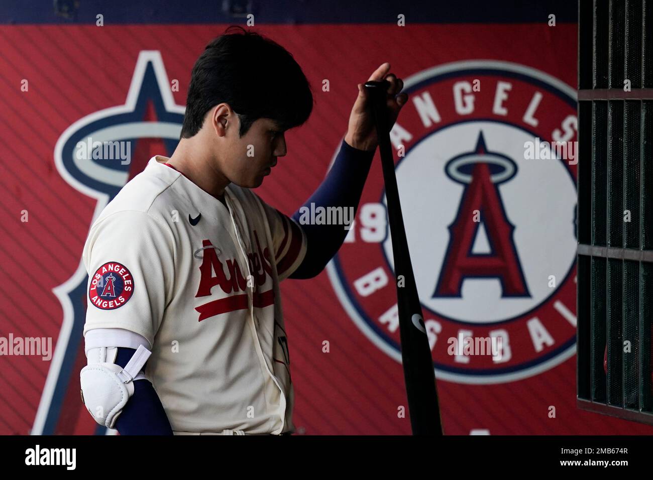Los Angeles Angels' Shohei Ohtani grabs his bat during the first inning ...