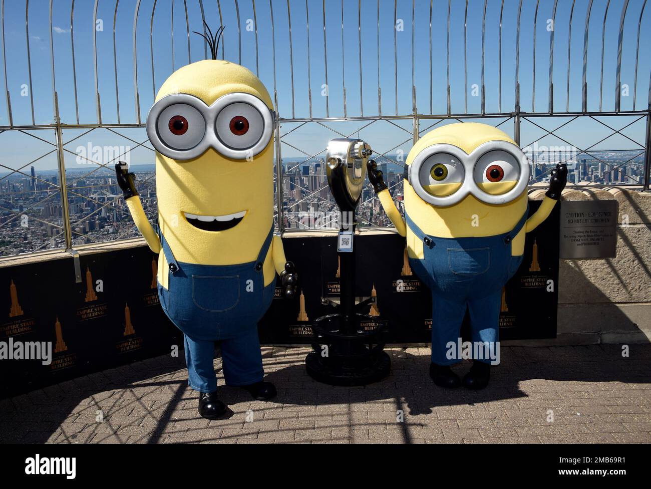 Minion characters Kevin, left, and Bob pose on the 86th floor ...