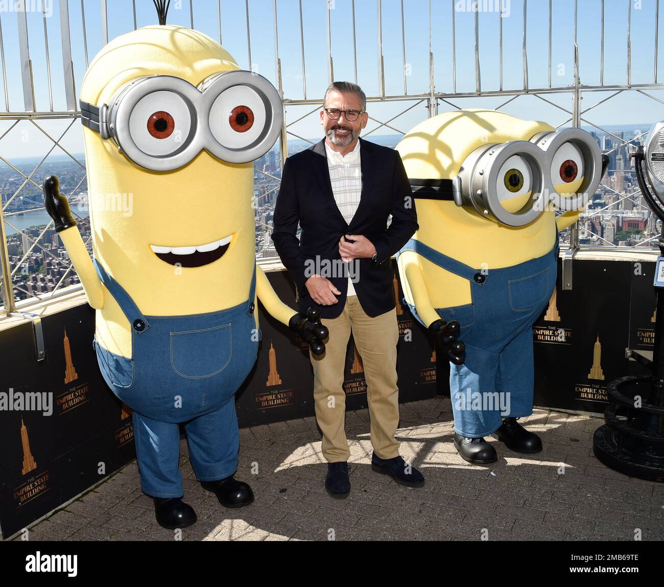 Actor Steve Carell and two Minion characters pose on the 86th floor ...