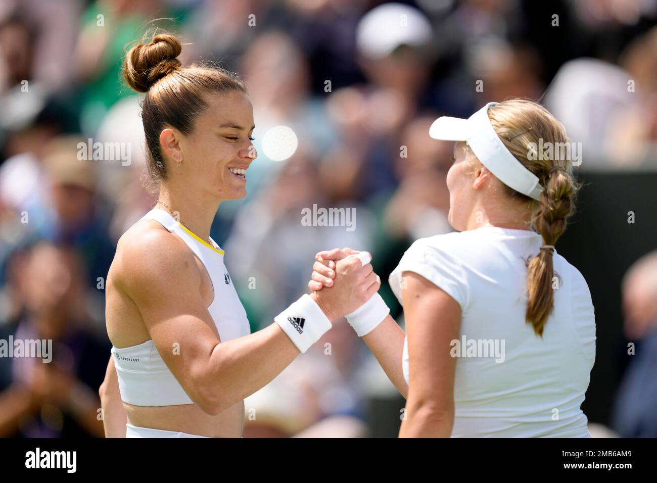 Greece's Maria Sakkari, left, shakes hands with Australia's Zoe Hives ...