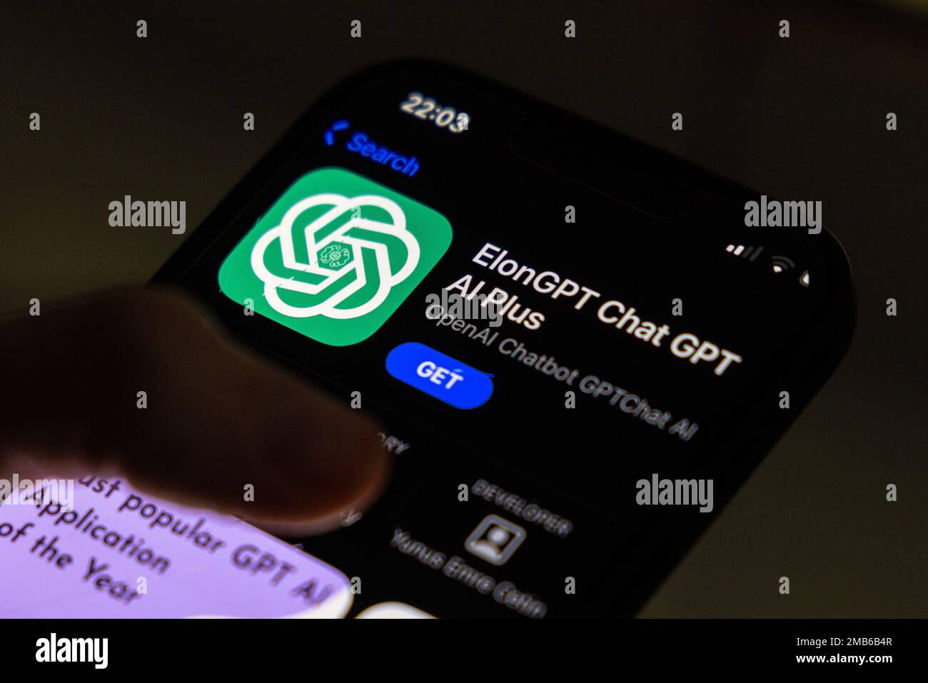 Woman's hand holding an iPhone with appstore and ChatGPT and Chat bot ...