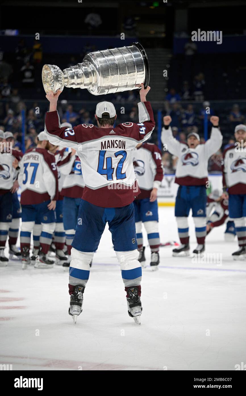 Colorado Avalanche defenseman Josh Manson lifts the Stanley Cup after ...