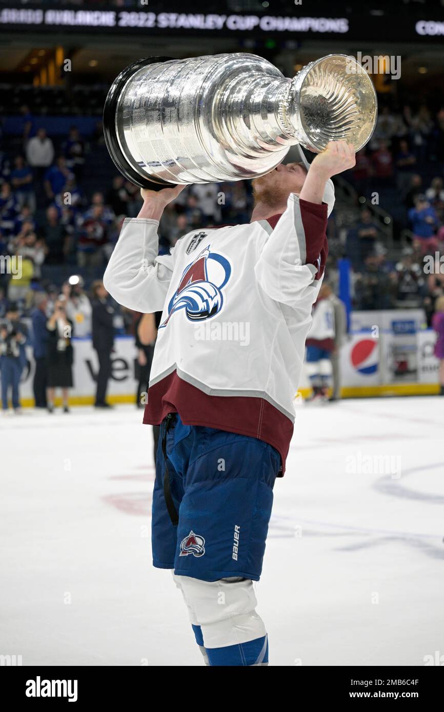 Colorado Avalanche defenseman Josh Manson kisses the Stanley Cup after ...