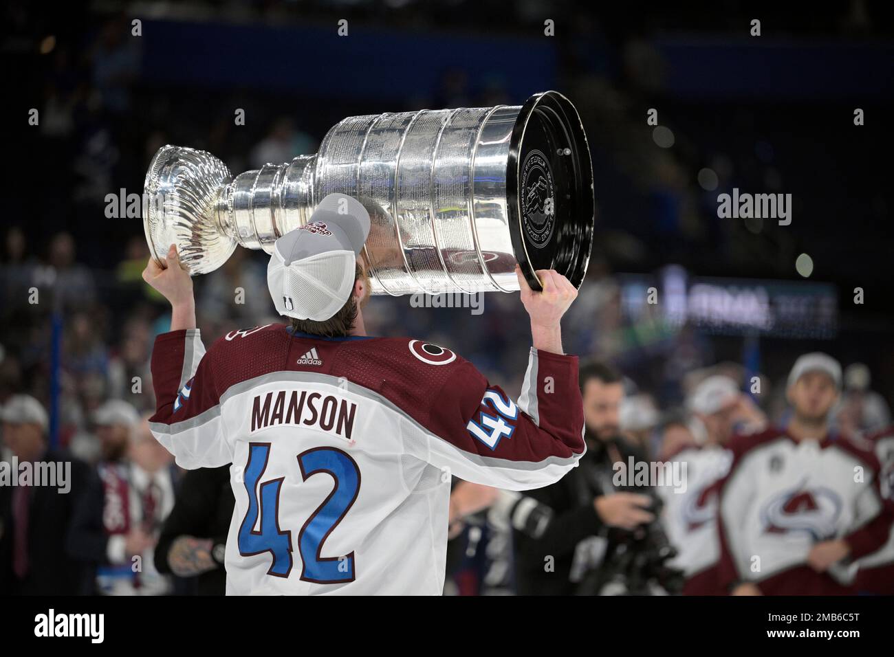 Colorado Avalanche defenseman Josh Manson (42) kisses the Stanley Cup ...