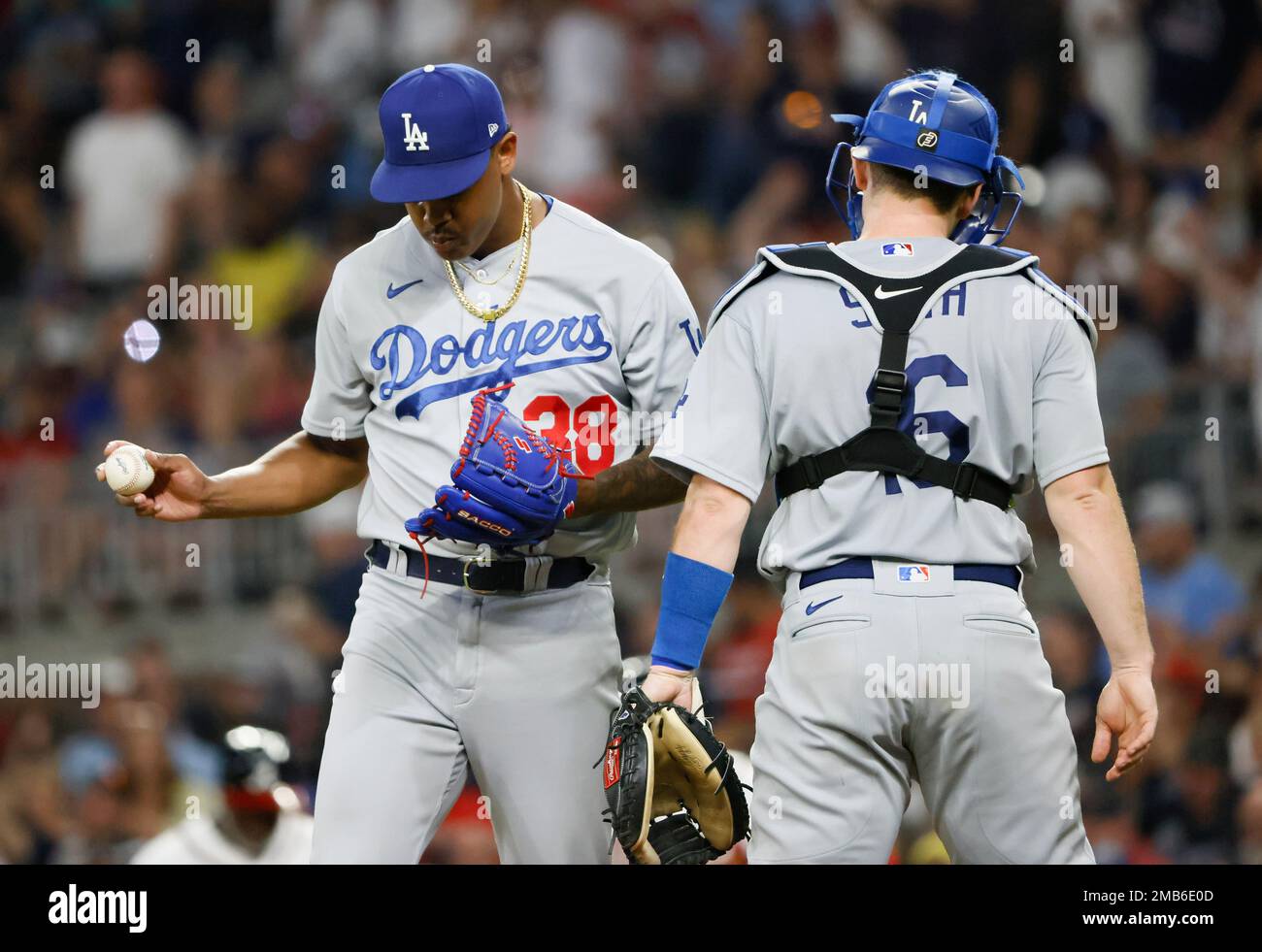 Los Angeles Dodgers' Yency Almonte confers with catcher Will Smith ...