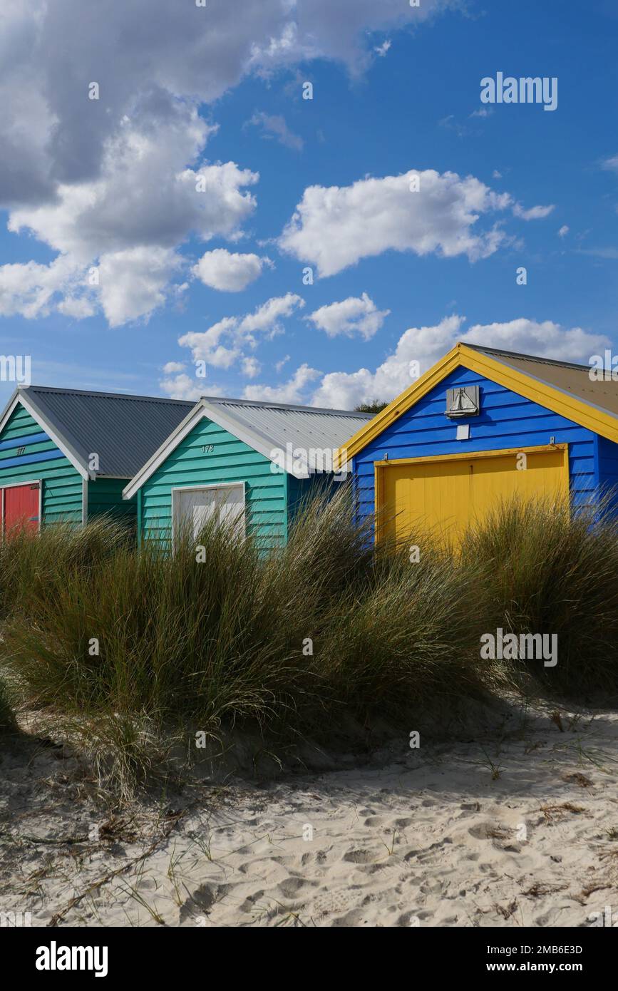 A vertical shot of cute buildings with colorful exteriors seen in ...