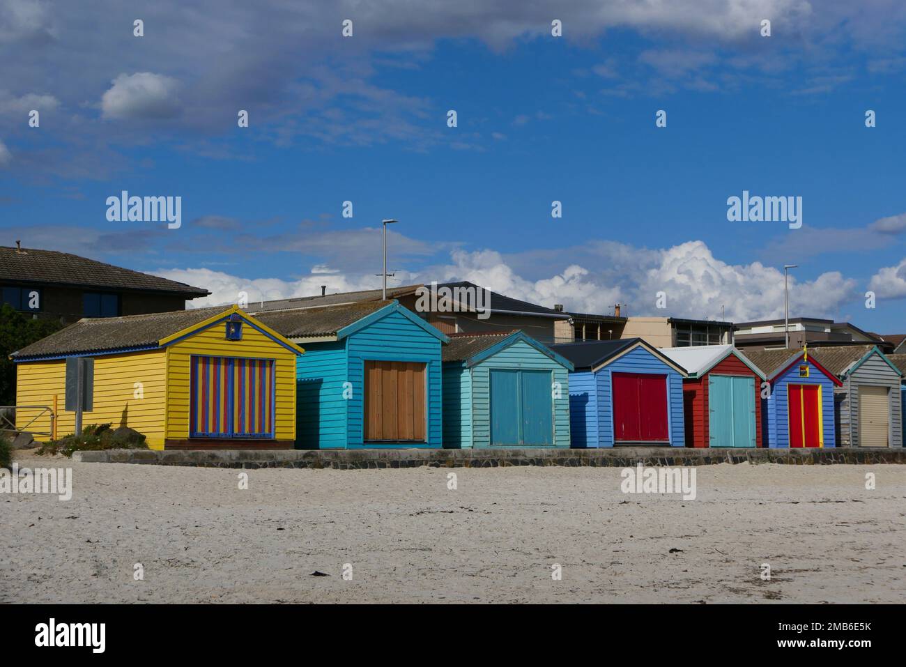 A scenic view of small colorful houses located on the shore of ...