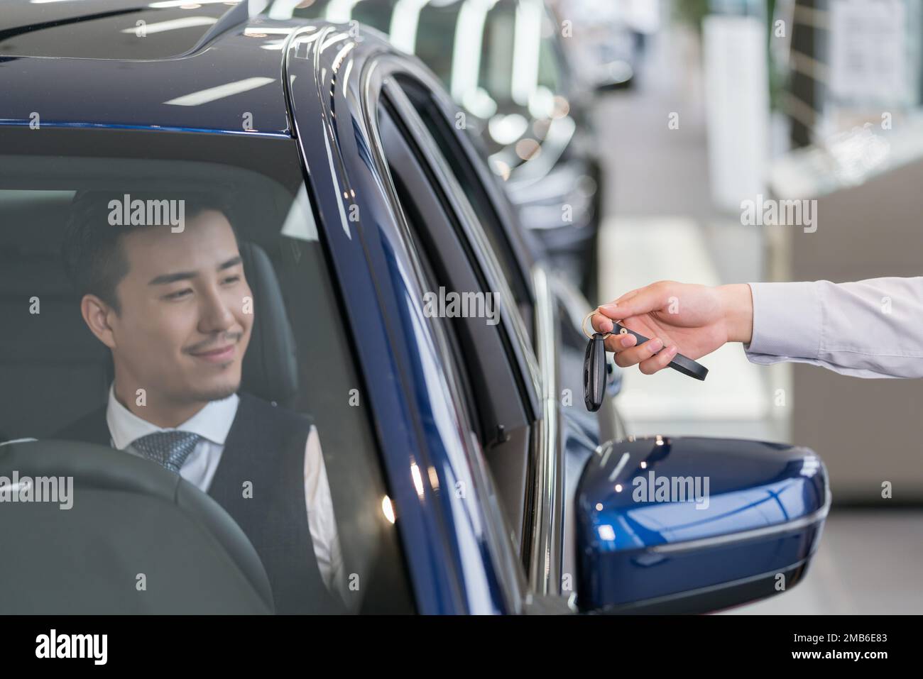 The young man test drive car Stock Photo - Alamy