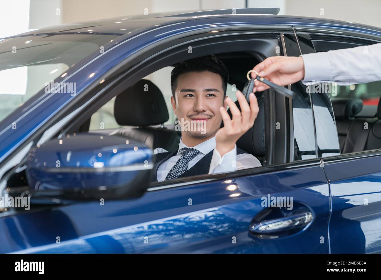The young man test drive car Stock Photo - Alamy