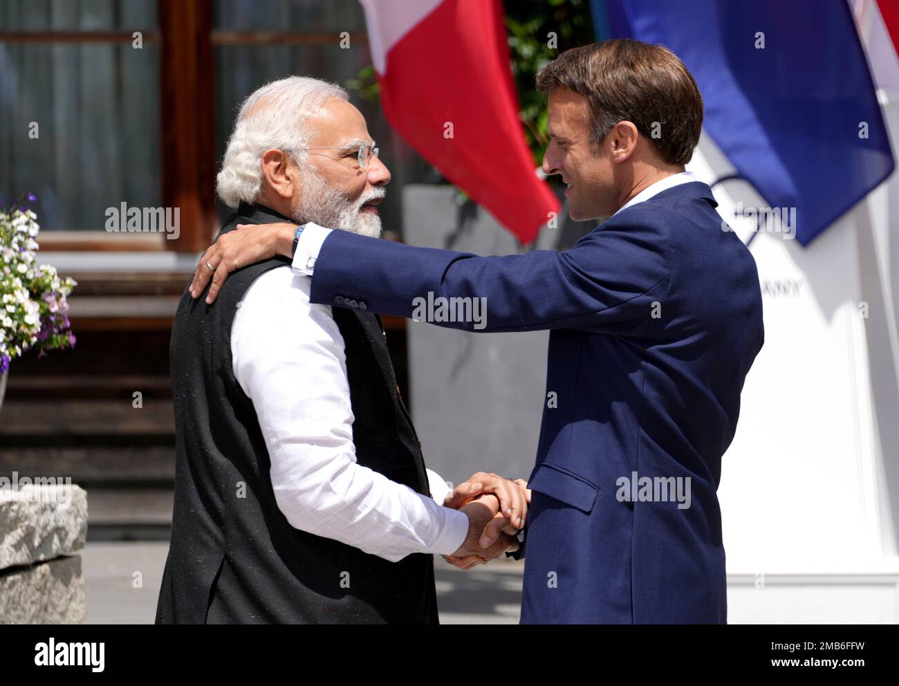 French President Emmanuel Macron, right, greets India's Prime Minister ...