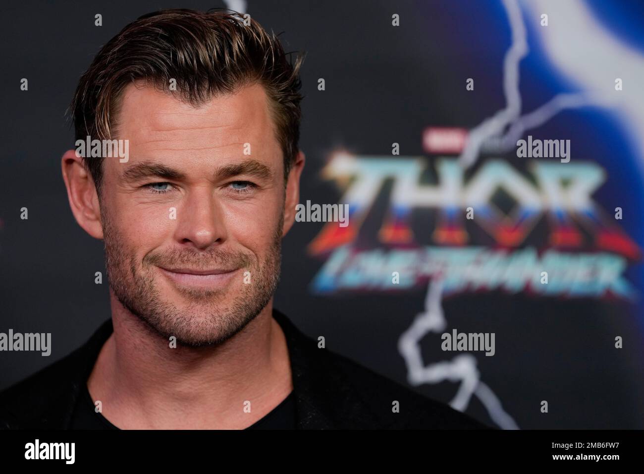 Australian actor Chris Hemsworth poses for a photo during a red carpet ...