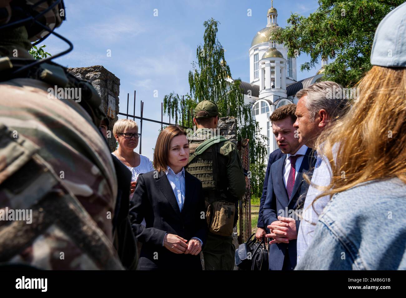 President of Moldova Maia Sandu, center, visits the Church of Saint ...