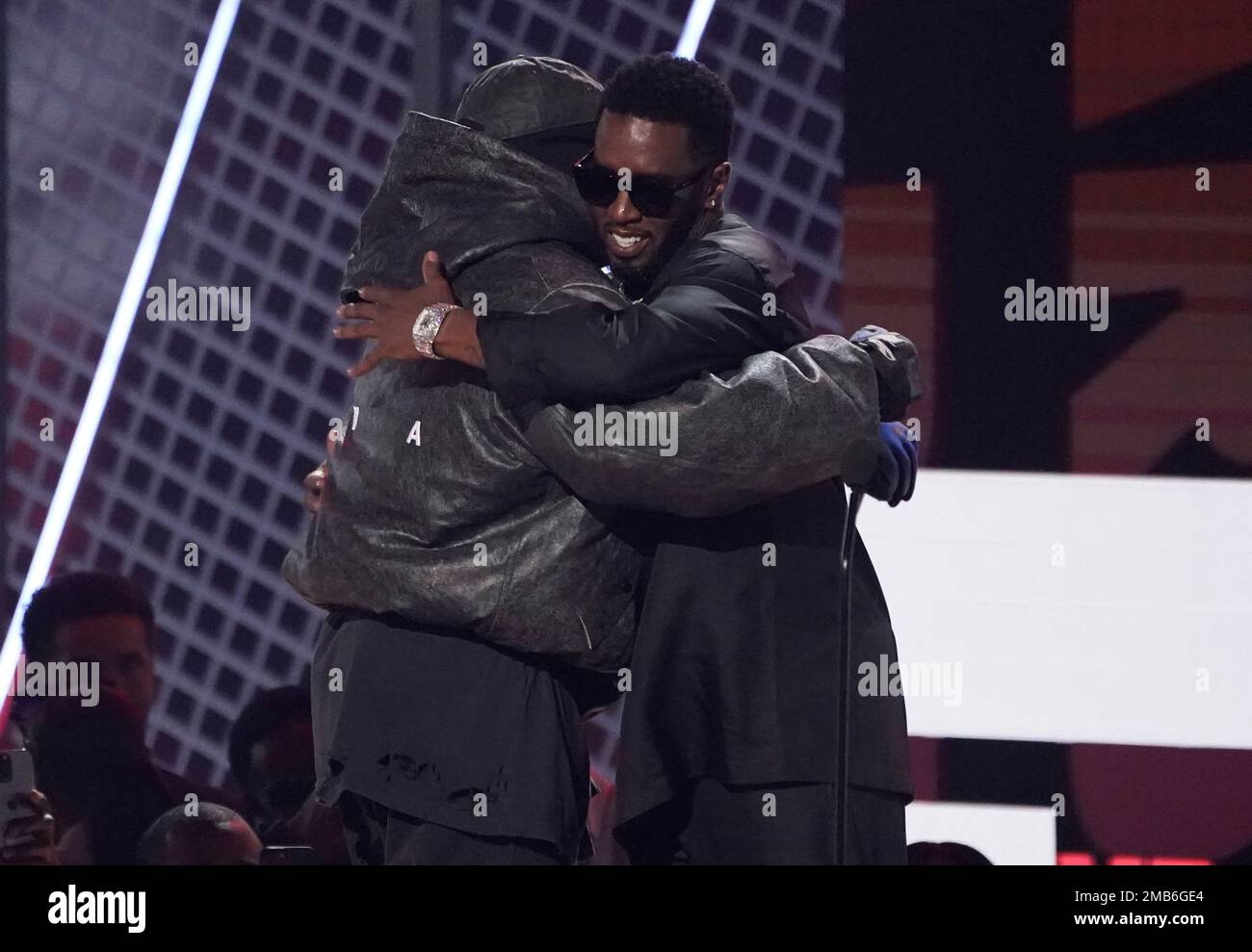 Kanye West, also known as Ye, left, presents the lifetime achievement ...