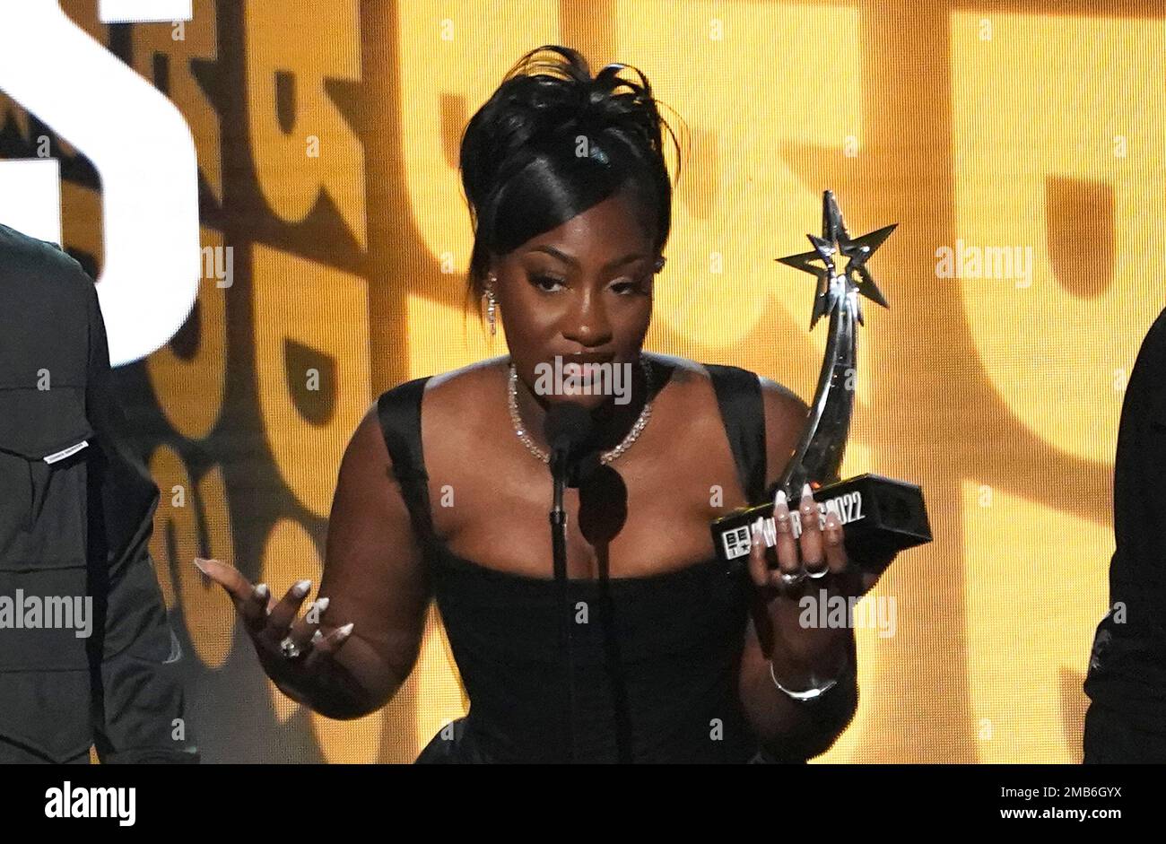 Tems, Nigerian singer, accepts the award for best international act at ...