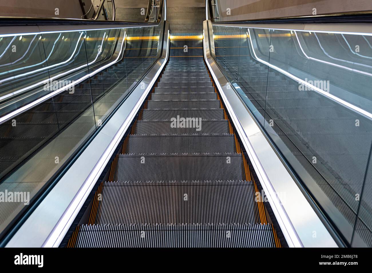 Modern luxury escalator with staircase without people. moving staircase ...