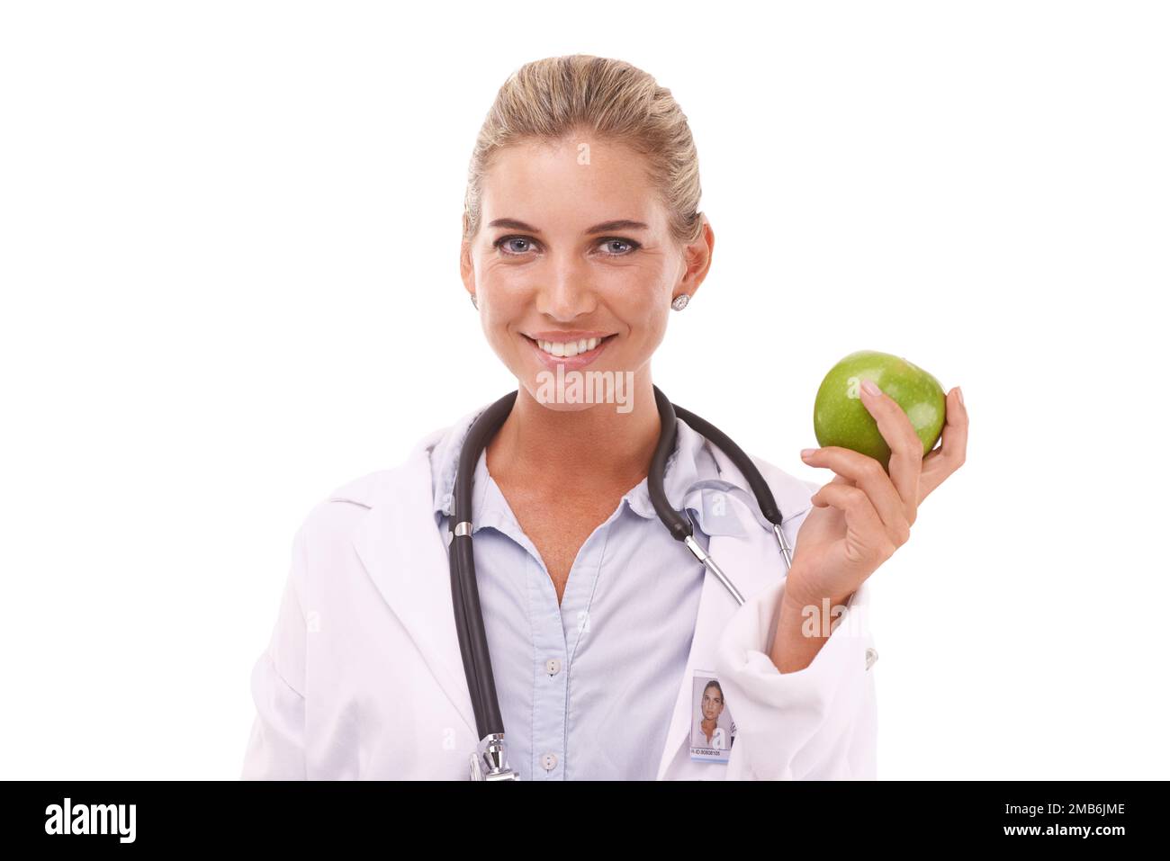 Woman doctor, apple and studio portrait for nutrition, wellness and ...