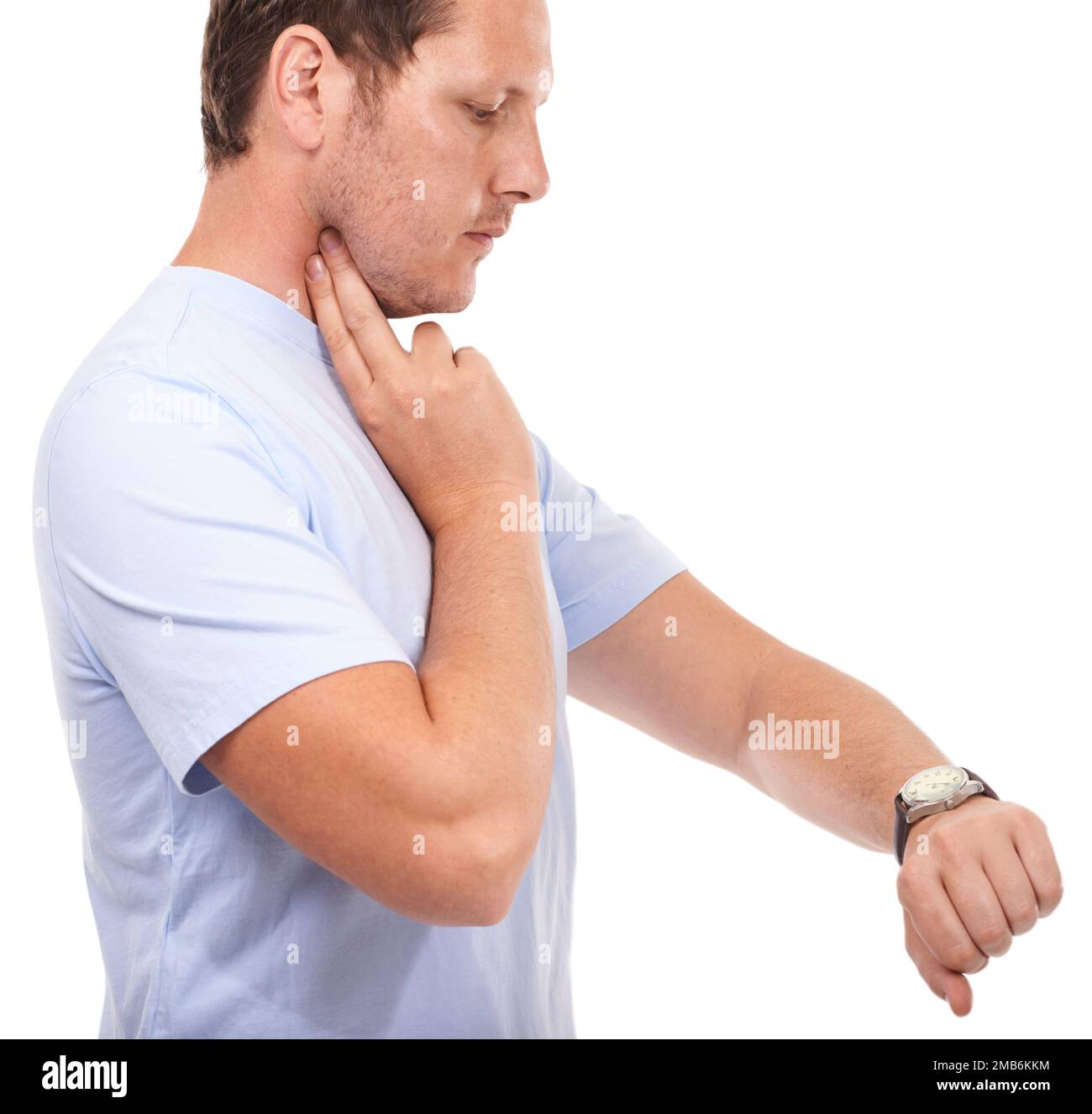 Monitoring his heart rate. Young man taking his heart rate against a ...
