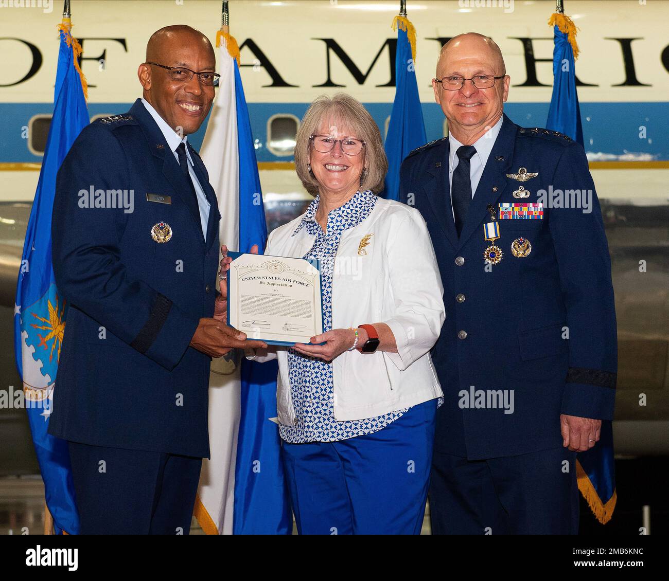 Air Force Chief of Staff Gen. CQ Brown, Jr. (left) presents a ...