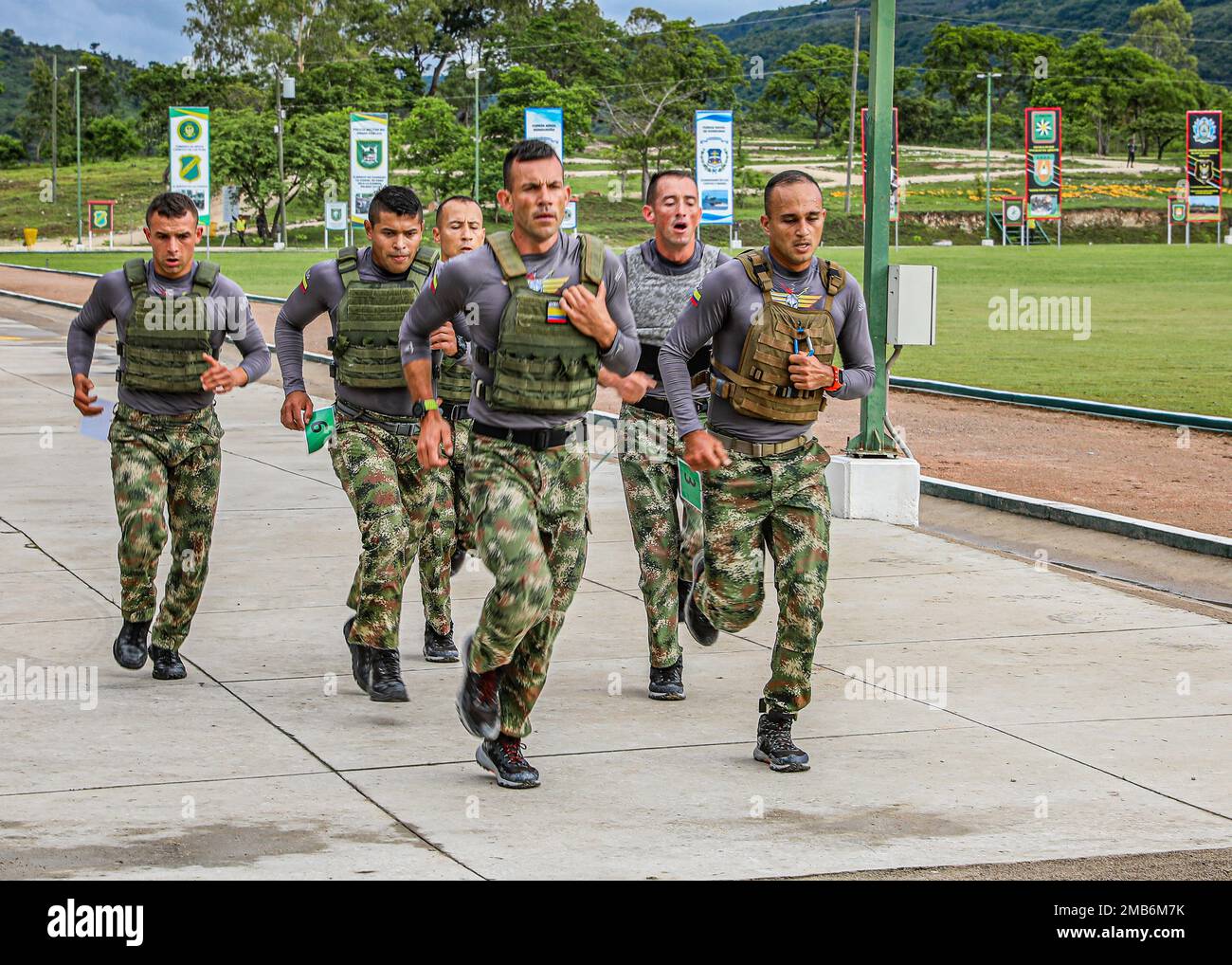 Colombian special operations soldiers run alongside one another during ...