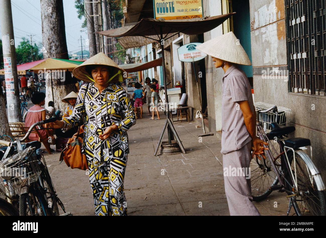 Ho Chi Minh City Vietnam Street Scene People wearing the Non La' (Palm ...