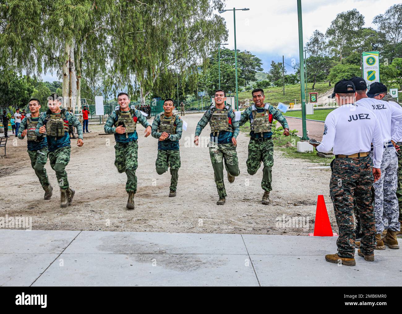 Members of the Mexican special operations forces (SOF) cross the finish line of a 2-mile ...