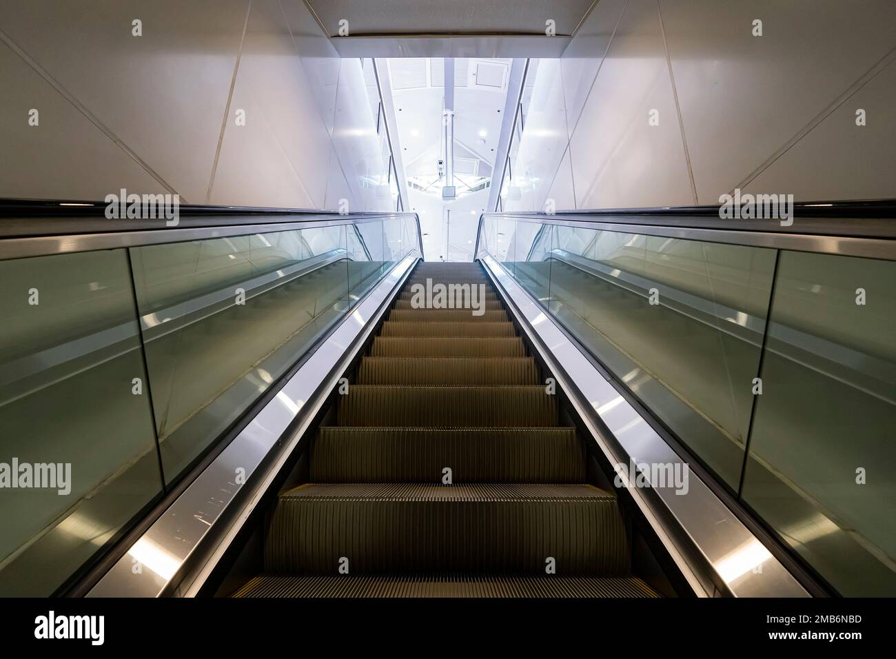 Detail of escalator with rubberized hand rail and steel steps Stock ...