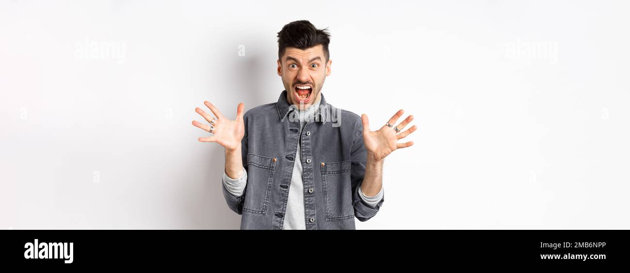 Angry man scream and look scary at camera, shouting with furious and ...