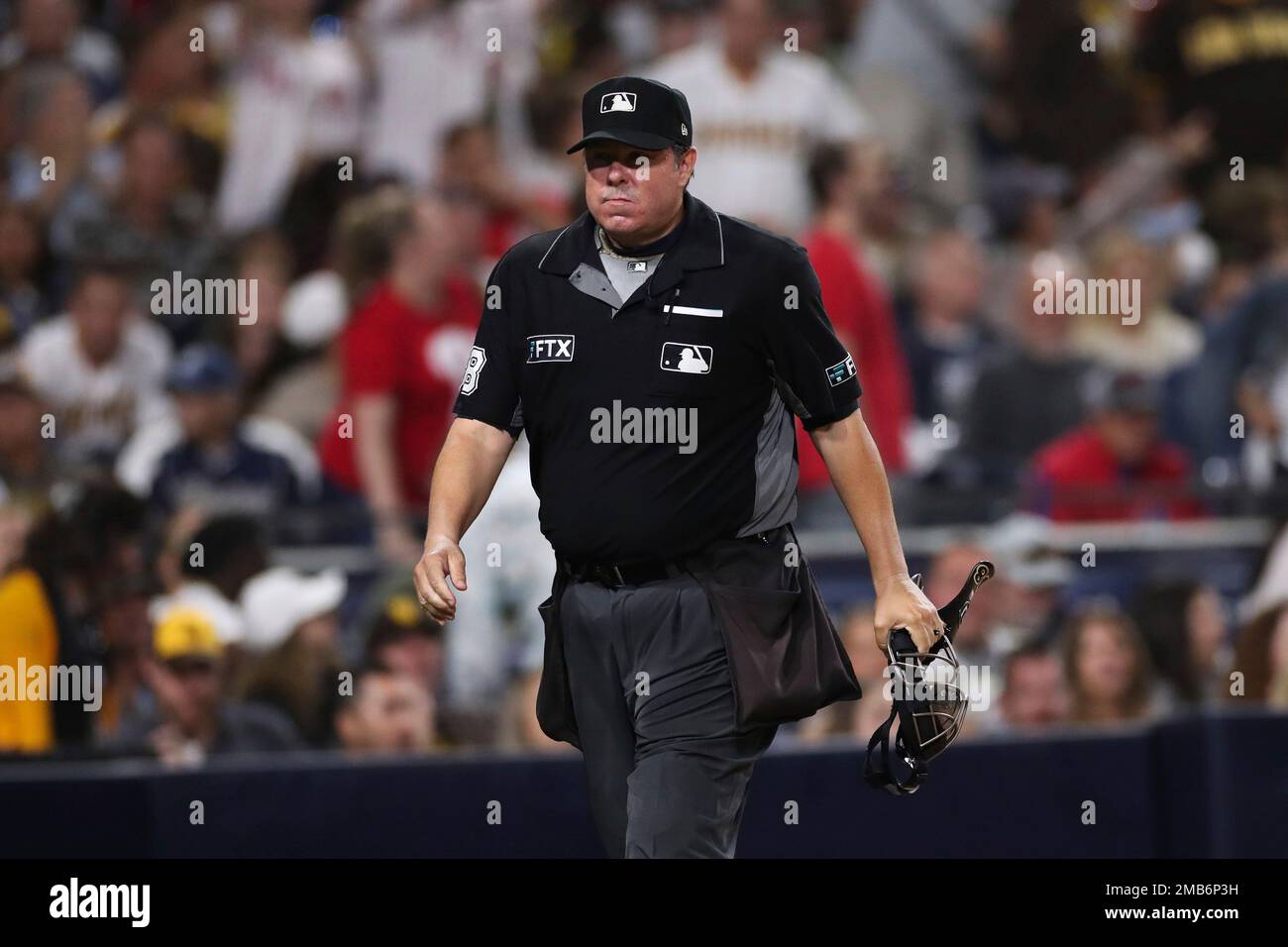 Umpire Doug Eddings works in a baseball game between the San Diego ...