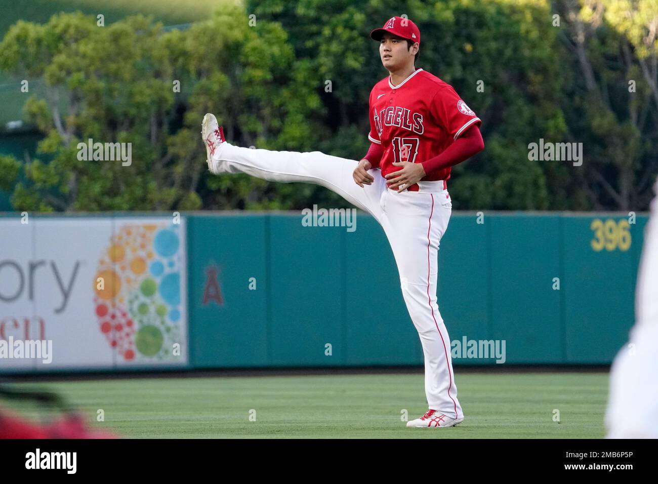 Los Angeles Angels' Shohei Ohtani smiles as he warms up prior to a ...