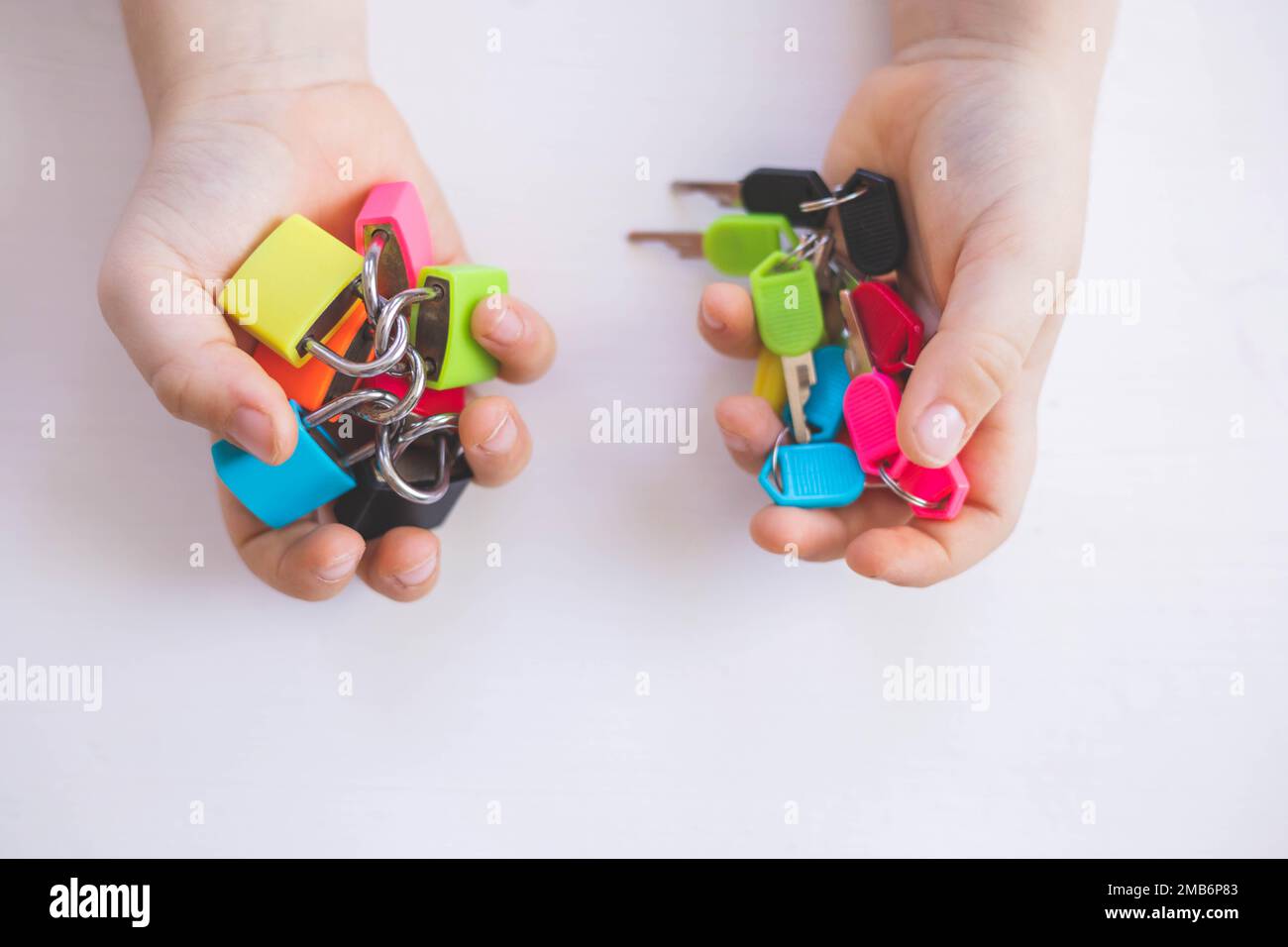 The child works with Montessori material with colored locks. Picks up ...