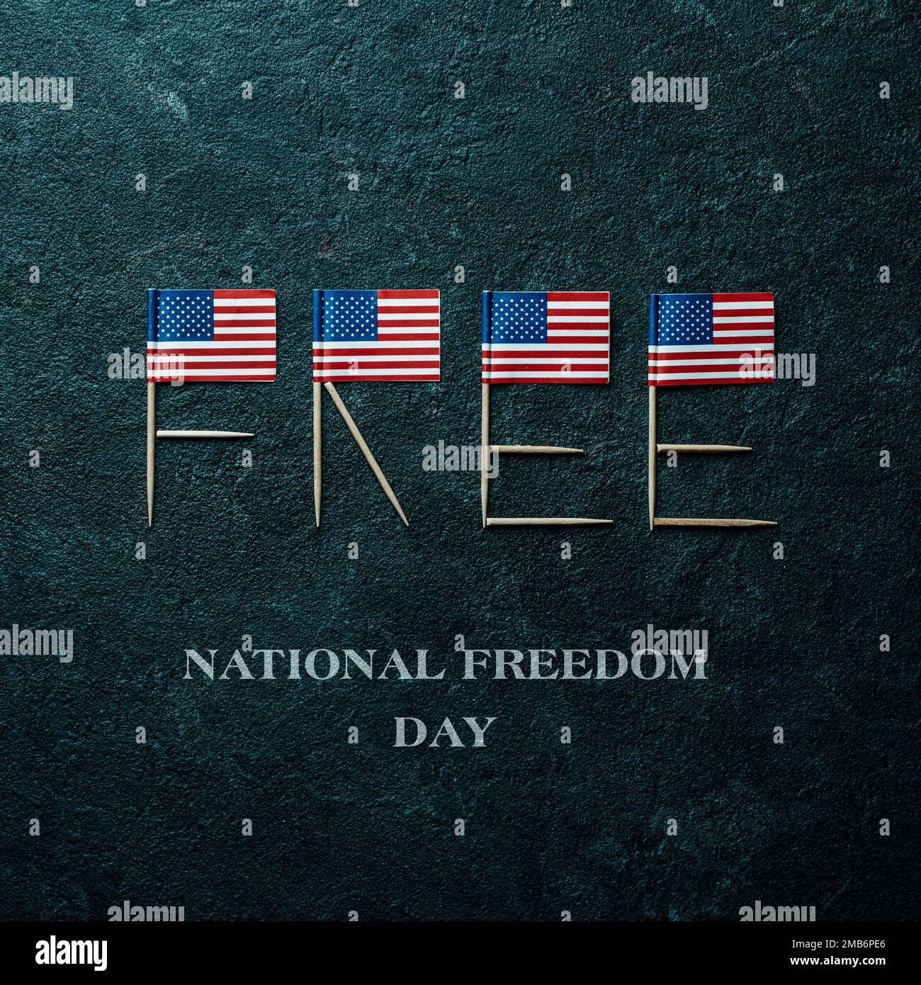 some US flags forming the word free with their poles, and the text ...