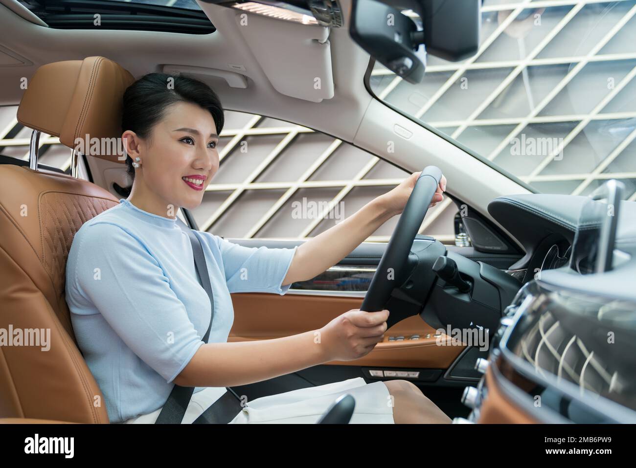 The young woman driving Stock Photo - Alamy