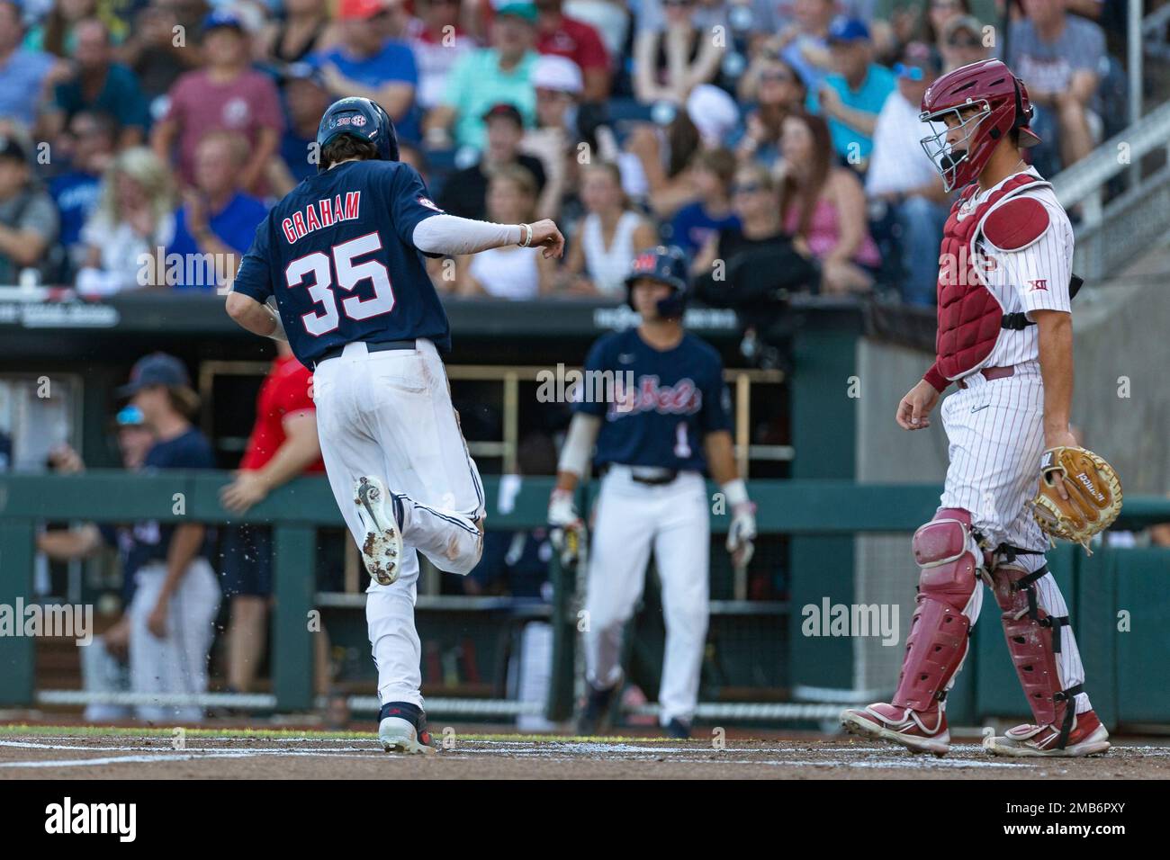 Mississippi' Kevin Graham (35) scores a run against Oklahoma in the ...