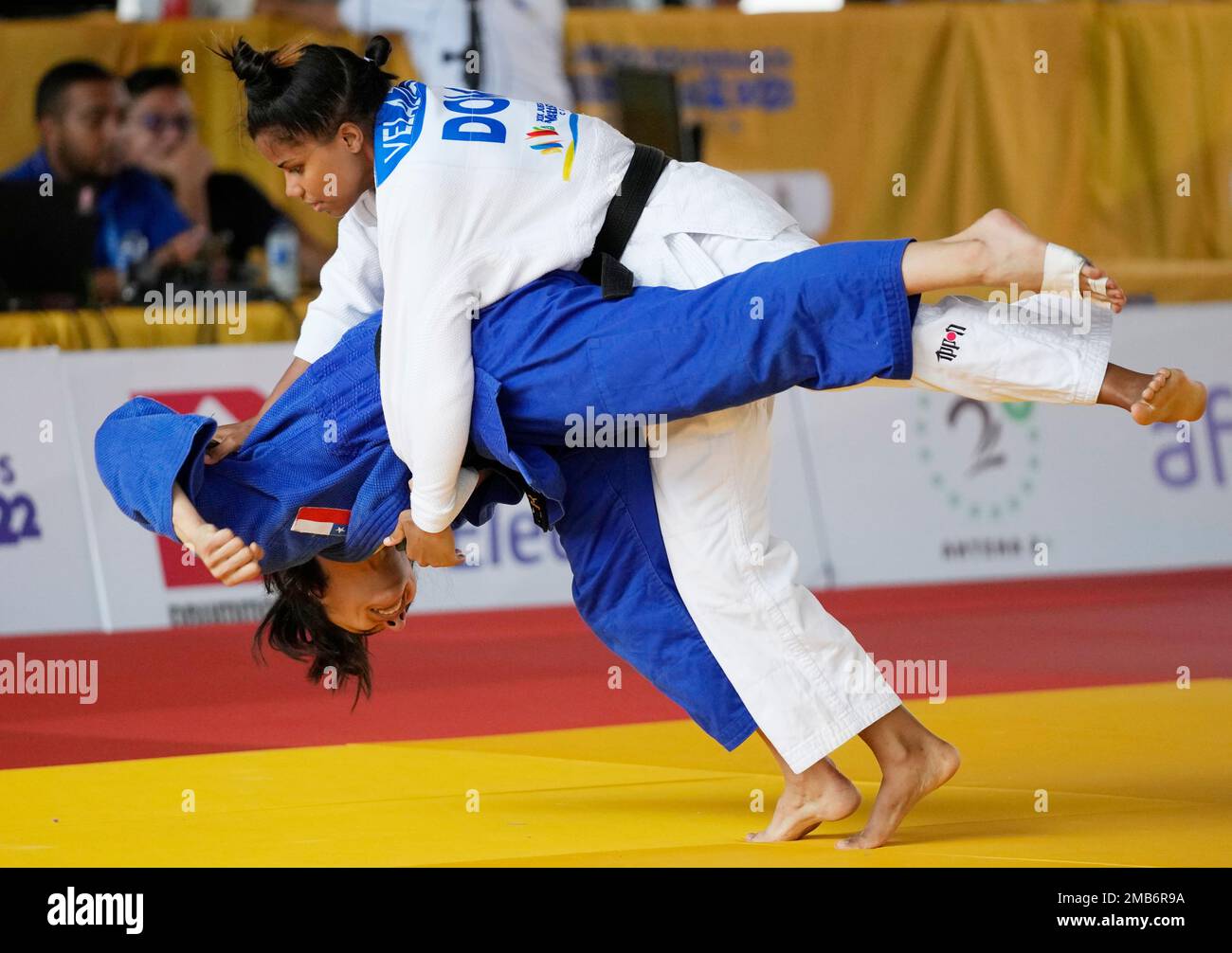 Judith Gonzalez of Chile, in blue, competes against Coral Velasquez of ...